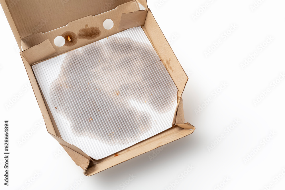 Empty pizza box with grease stains isolated on white. Top view. Copy ...