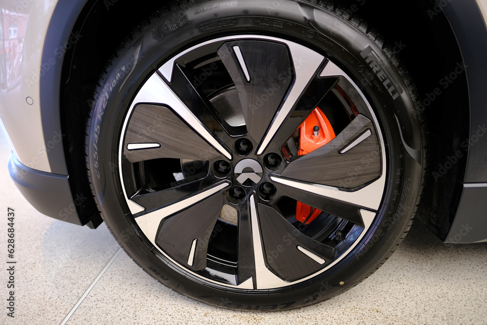 caps of wheel with red calipers of electric car NIO, all-electric sedan ...