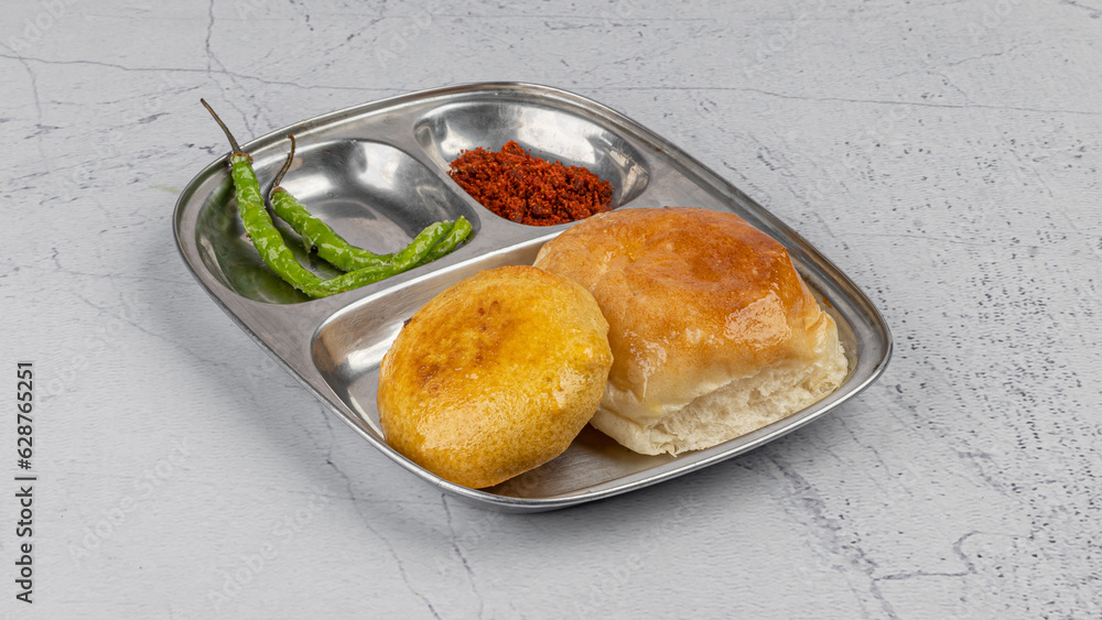Vada Pav or Vada Paav with chutney is a famous Indian street food in ...