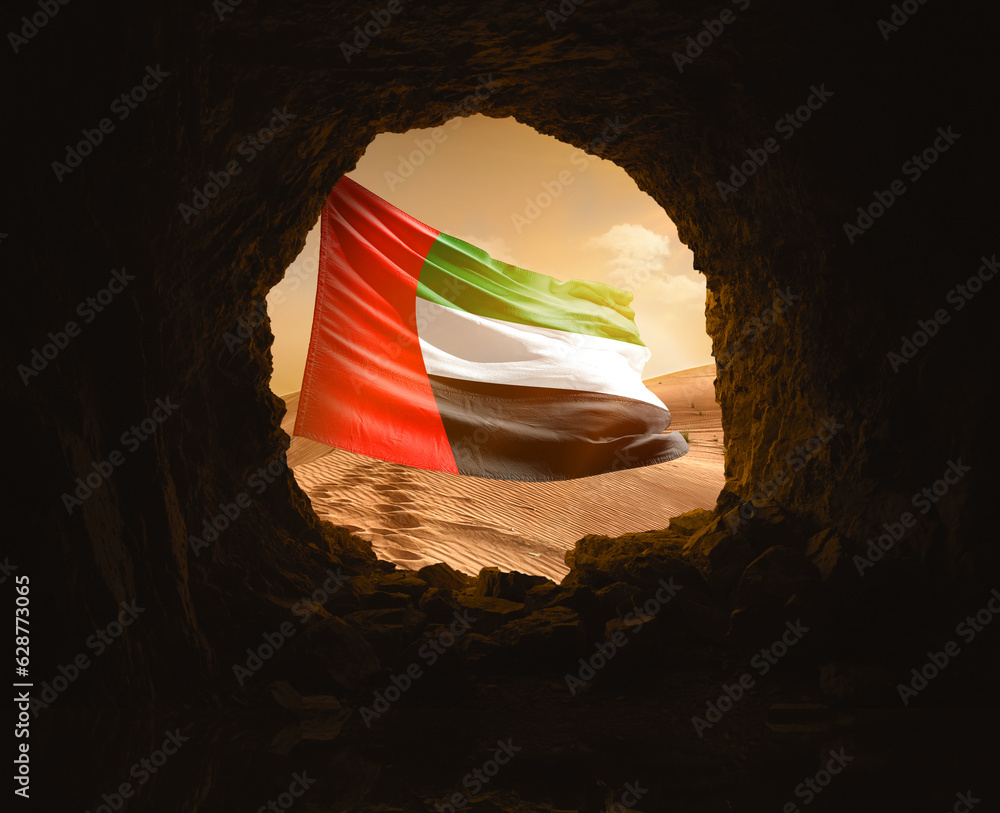 Vintage cave with UAE national flag waving in beautiful sunlight Stock ...