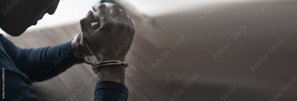 sad man hand handcuffs Stock Photo | Adobe Stock