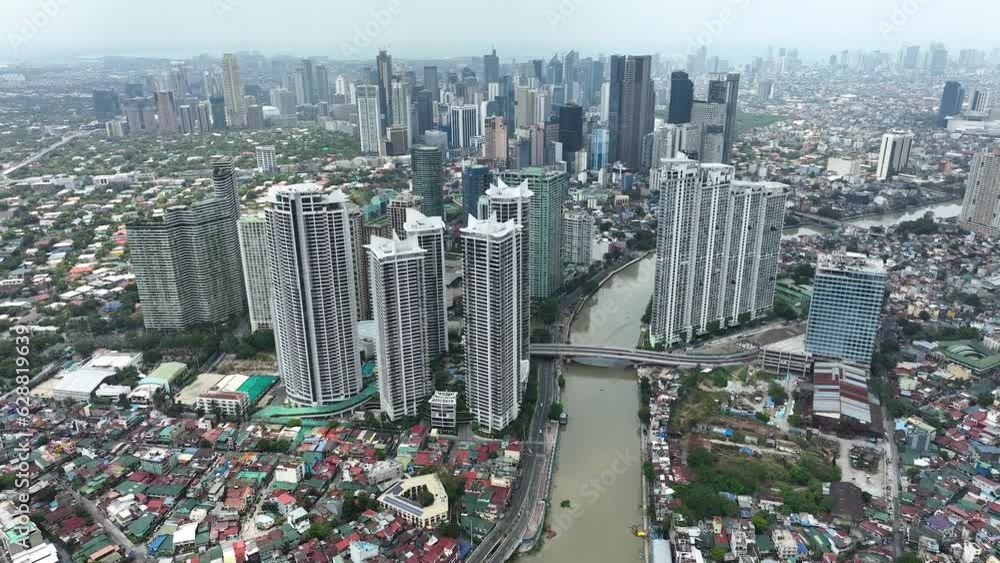 Manila cityscape at river banks aerial. Downtown area with cottages ...