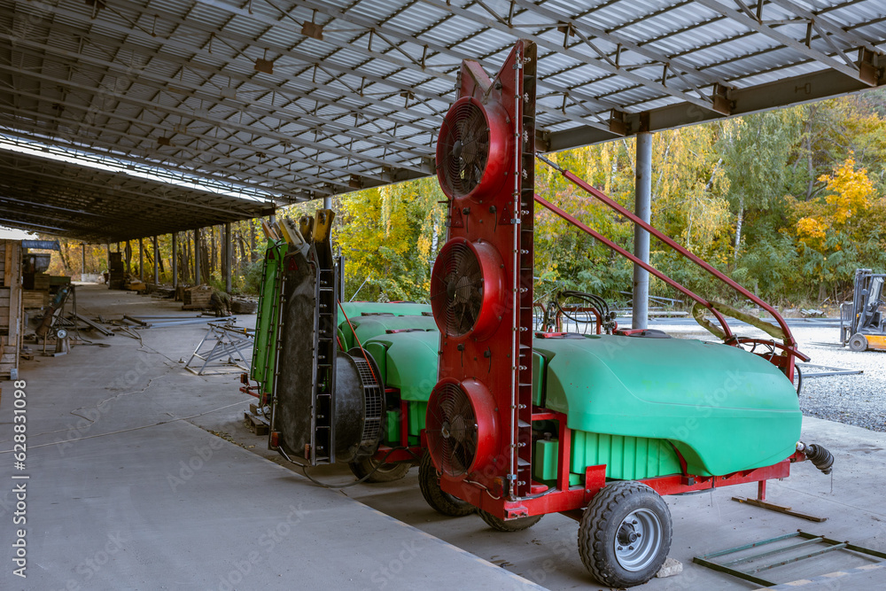 Trailed orchards sprayer, equipped with a counter-rotating fan. The ...