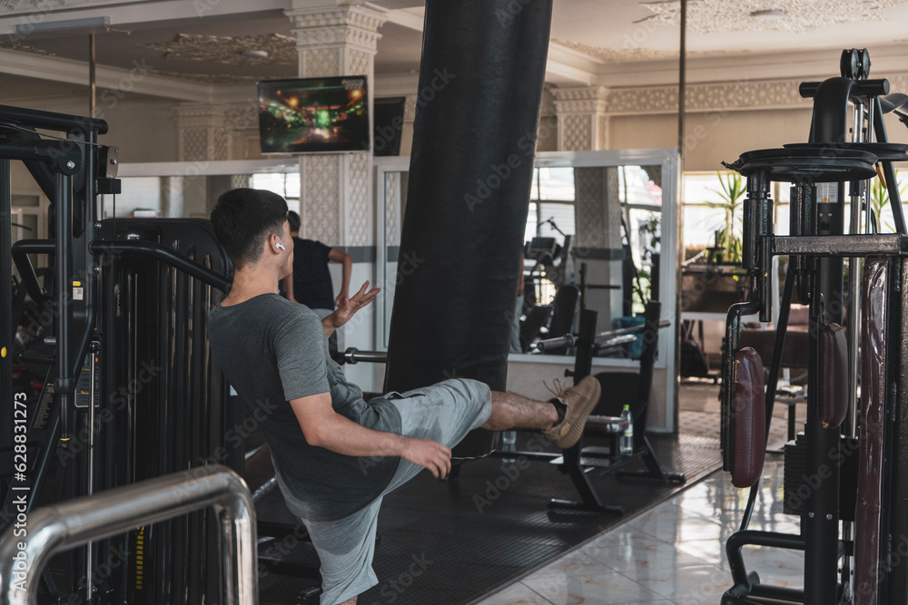 heavy workout gym with multiple equipment randomly working out in a gym ...