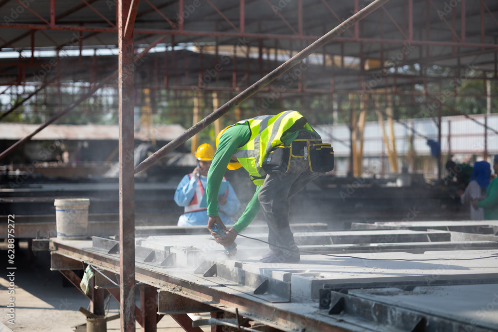 Labor man cutting steel at the construction site. Heavy Industry ...