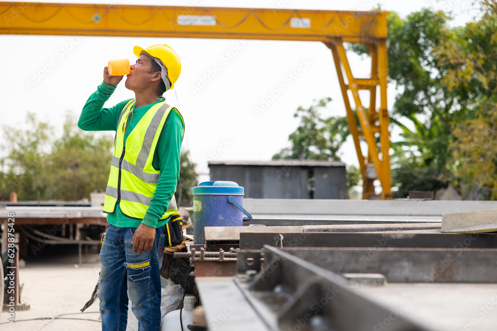 Take a break from hard work. Tired hot wiping sweat. Construction ...