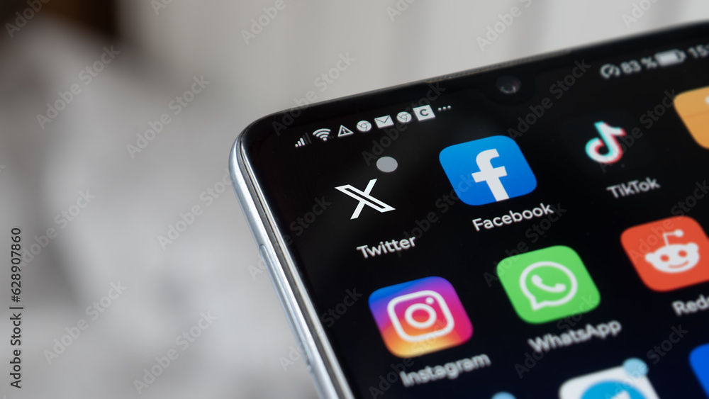 Someone holds a phone to open a social media, short focal length and ...