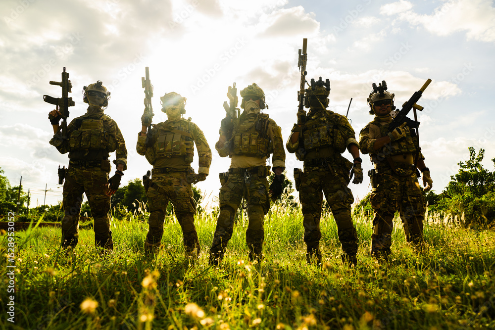 Smart teamwork of soldiers running forward and attacking enemy during ...