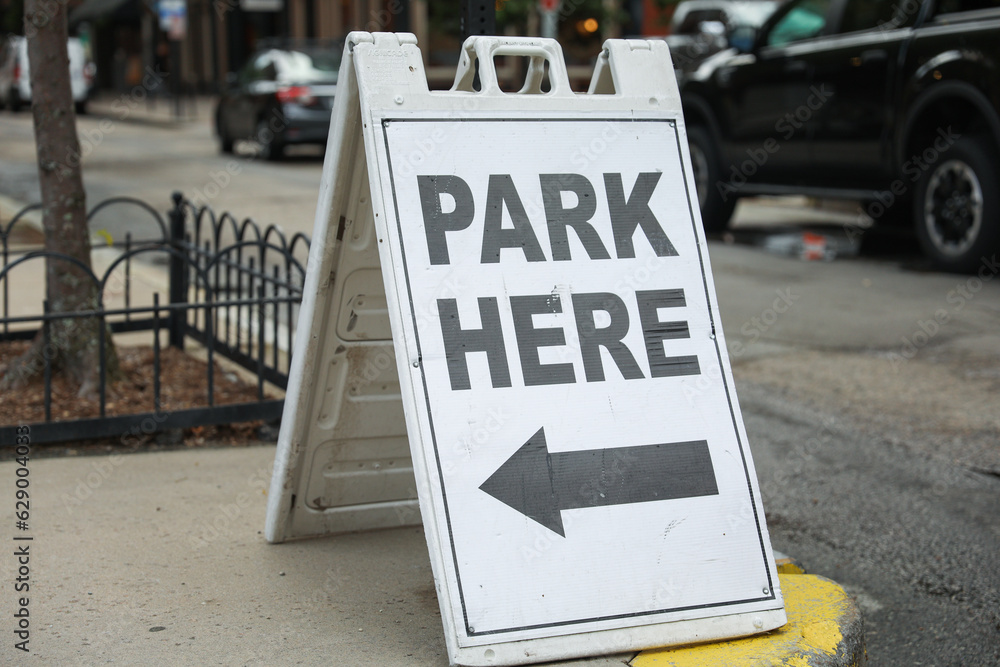 Park Here sign, representing space, convenience, access, and designated ...