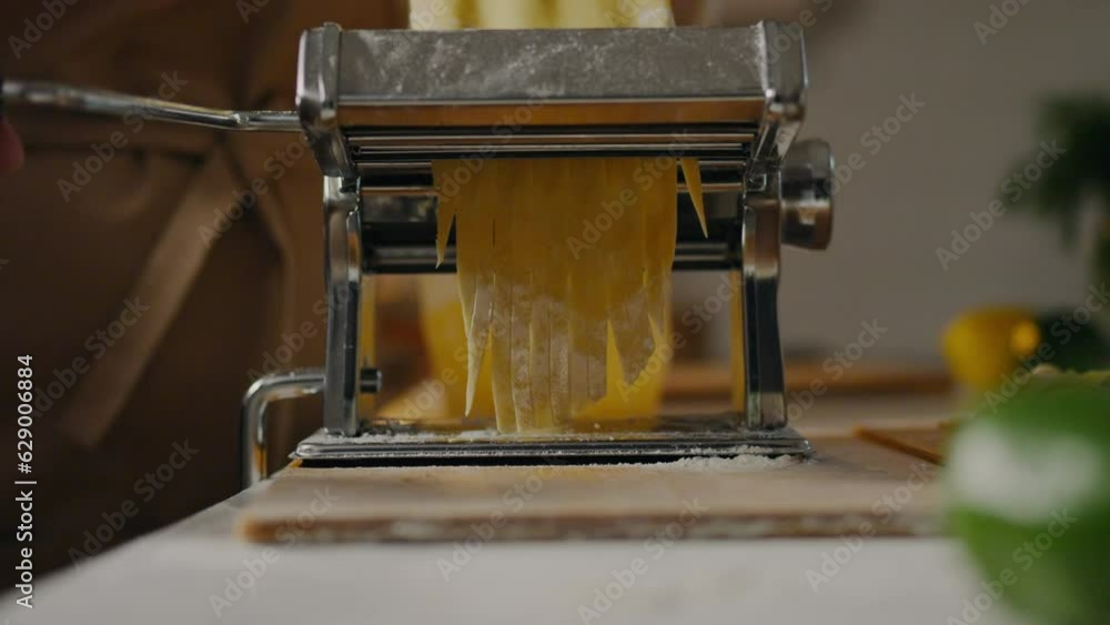 Italian, home kitchen chef Prepares spaghetti with his own hands in a ...