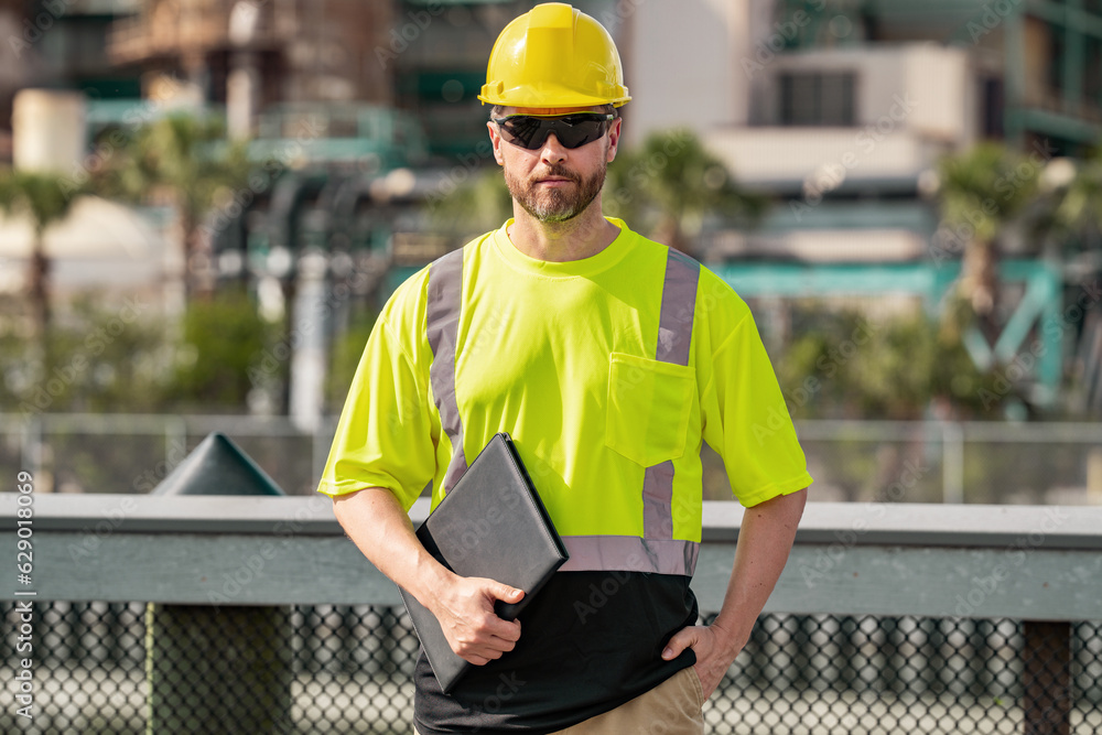 Hispanic 40 s builder on site construction. American middle aged man ...