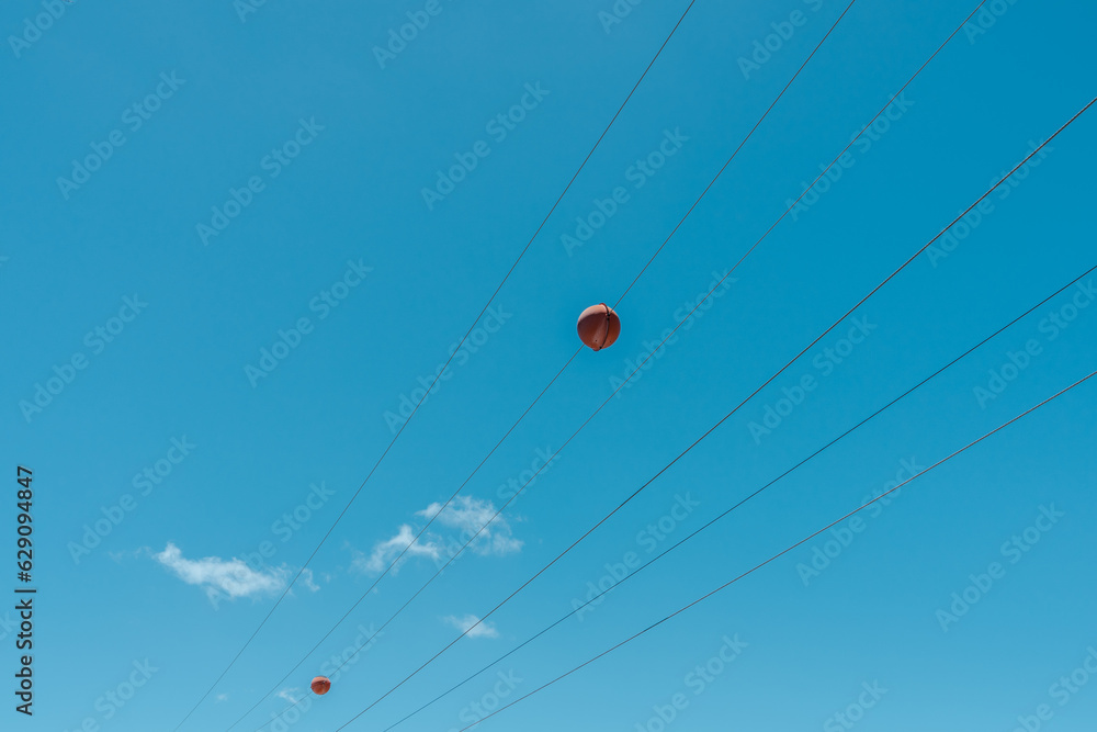 Balls Hang on Power Lines， visibility markers on power lines to help ...
