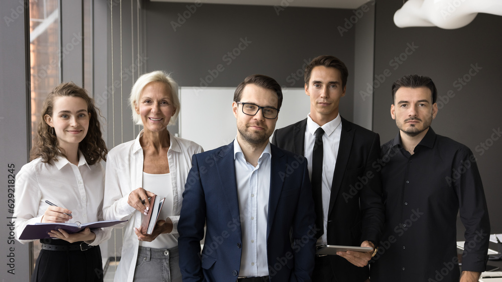 Team of positive confident business professionals of different ages ...