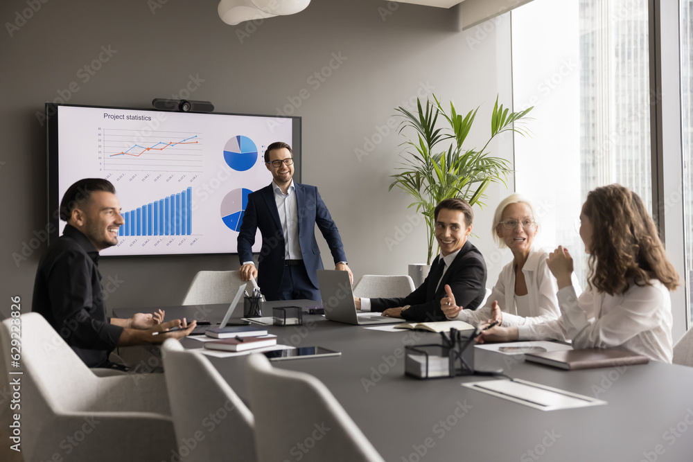 Happy different aged business team having fun on office meeting ...