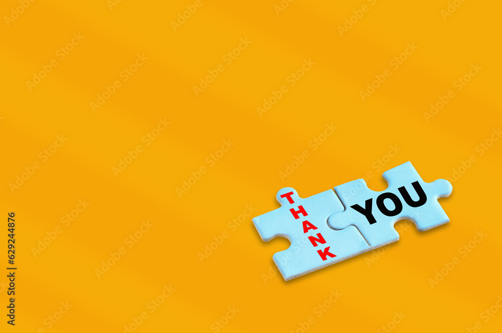 Thank you blue puzzle jigsaw with shadow on yellow background ...
