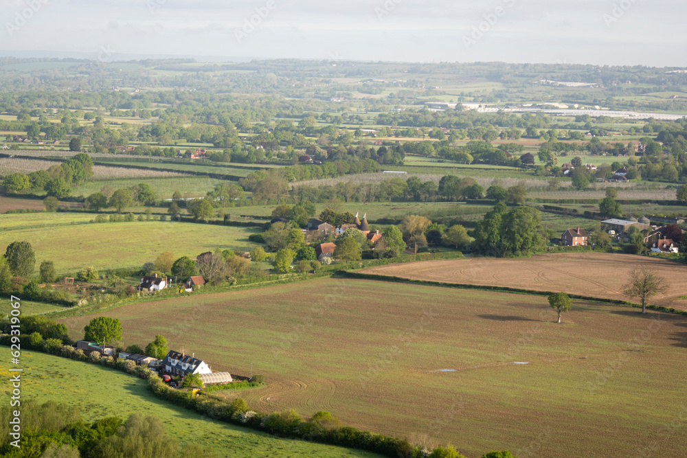 Aerial view of the fields and villages in the countryside in Kent, UK ...