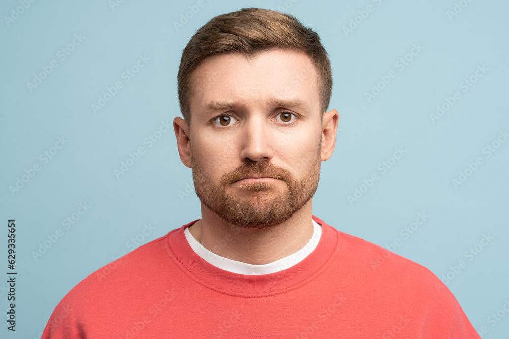 Young sad confused frustrated man with pursed lips in trouble isolated ...