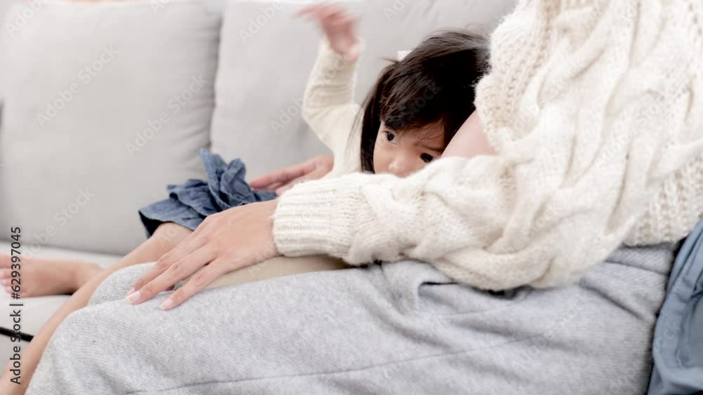 4k, Close up adorable preschool girl lying down on belly mom, pregnant ...