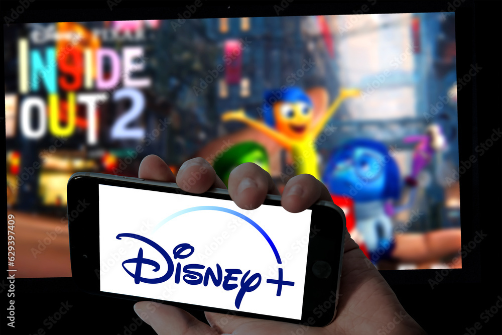 CHENNAI, INDIA, 31TH JULY 2023: Disney logo in holding mobile and ...