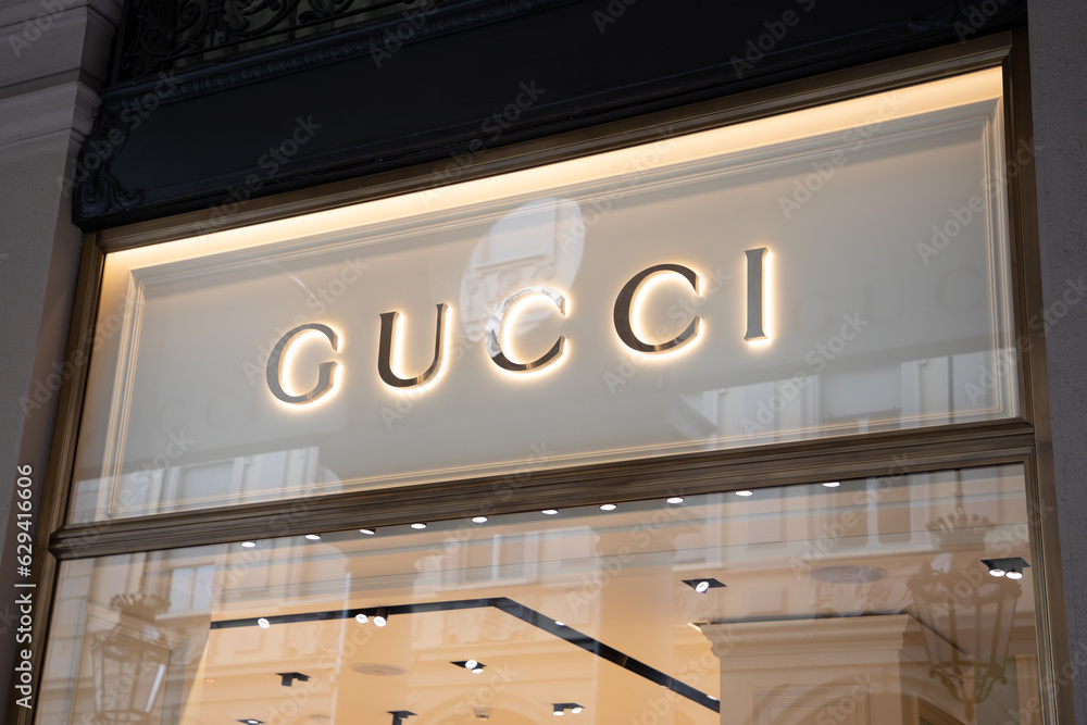 gucci store sign text and brand logo on windows facade entrance luxury ...