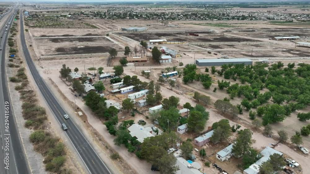 Farmhand and cowboy houses and homes in trailer park next to feedlot ...