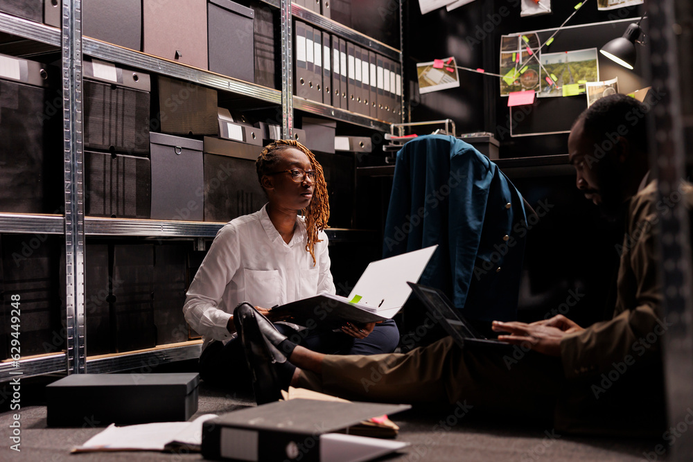 African american detective partners solving crime together and sitting ...
