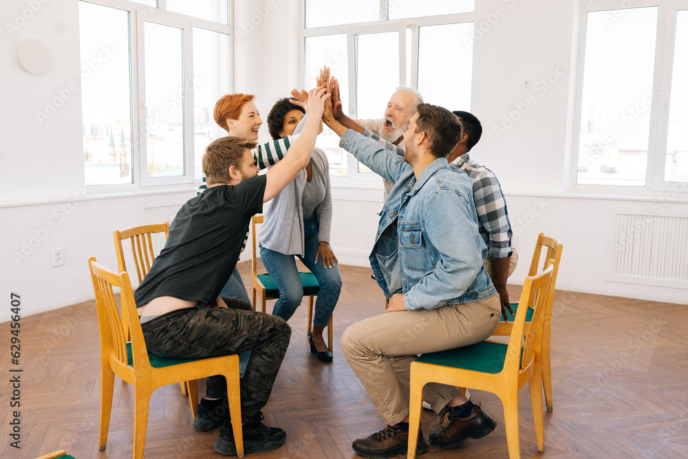 Diverse happy multicultural and different ages people reach hands to ...