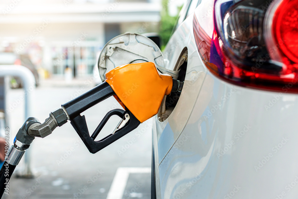 Refill and filling Oil Gas Fuel at station. Gas station - refueling. To ...