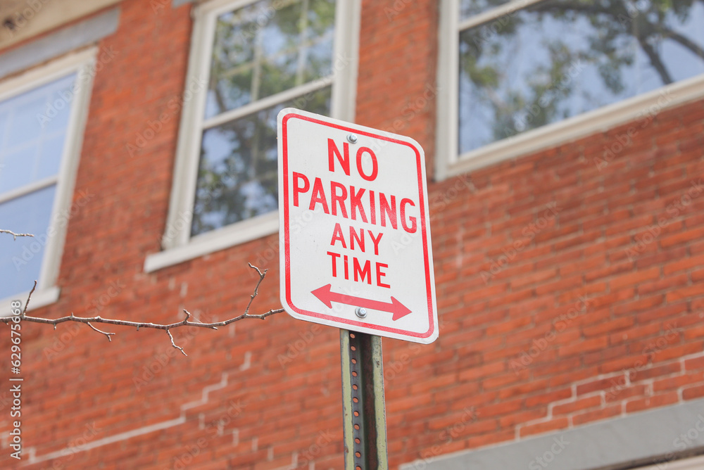No Parking sign on a city street, representing order, restriction, and urban regulations ...