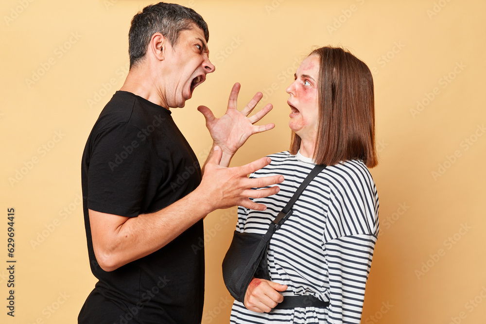 Aggressive violent screaming man and injured woman with bruise isolated ...