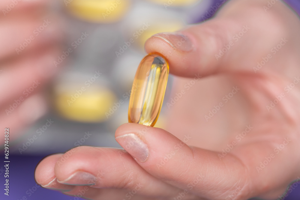 Fish Oil Capsules In Female Hands Omega Fatty Acids Jelly Capsules