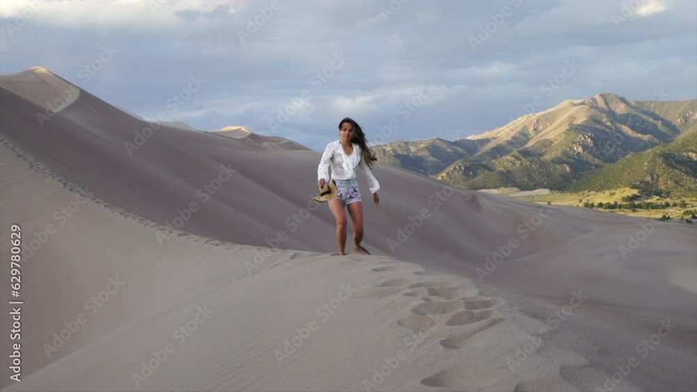 Cinematic female women actress Model running dancing atop ridge ...
