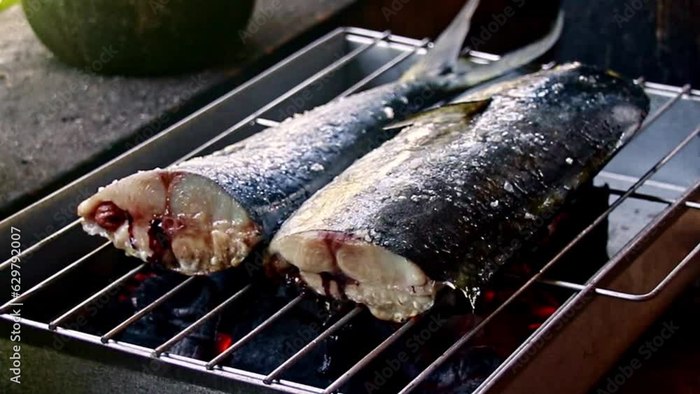 Fresh fish on a charcoal grill called inihaw or sinugba, an authentic ...