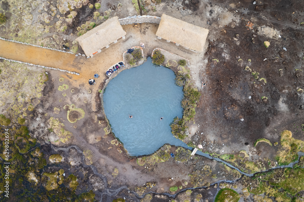 Flying above a volcanic hot spring in the wilderness of southern Peru ...