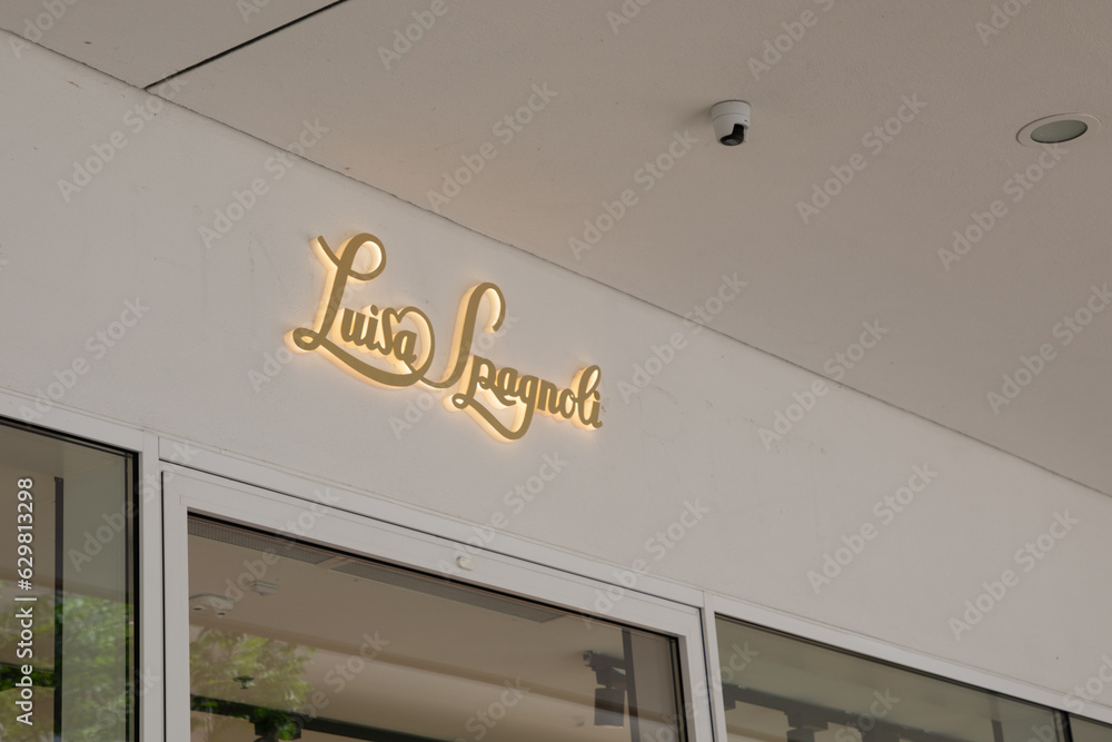 Luisa spagnoli logo sign and brand text facade wall entrance windows ...