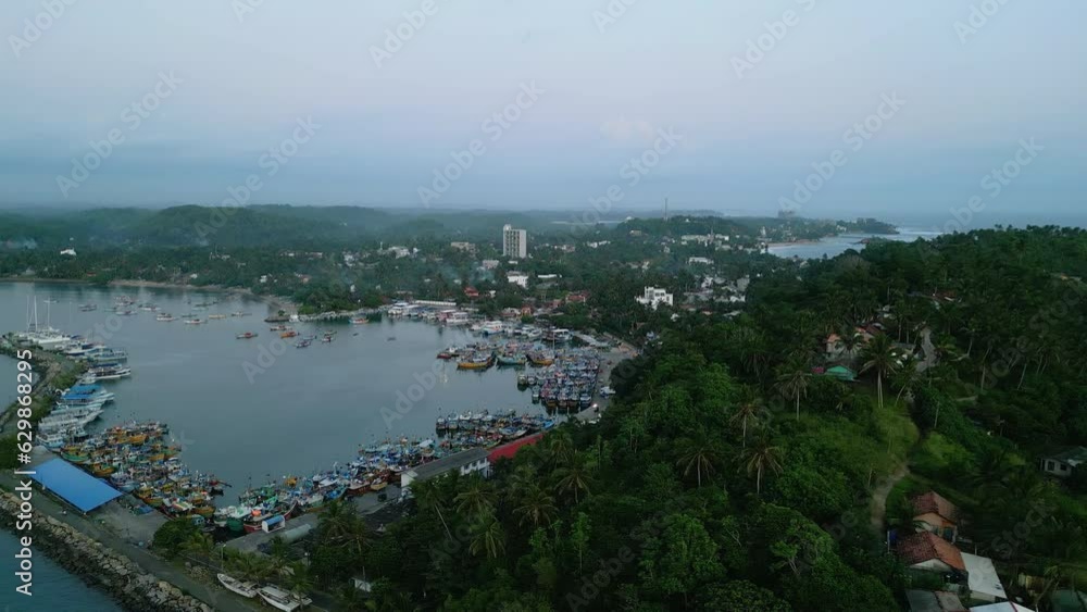 Fishery harbour on island in Indian ocean aerial view. Little colorful ...