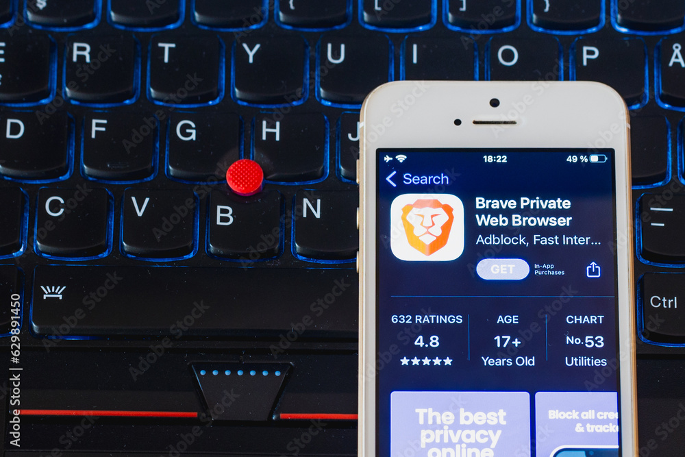 Brave Browser: Fast Adblocker dev app on Smartphone screen.Laptop pc ...