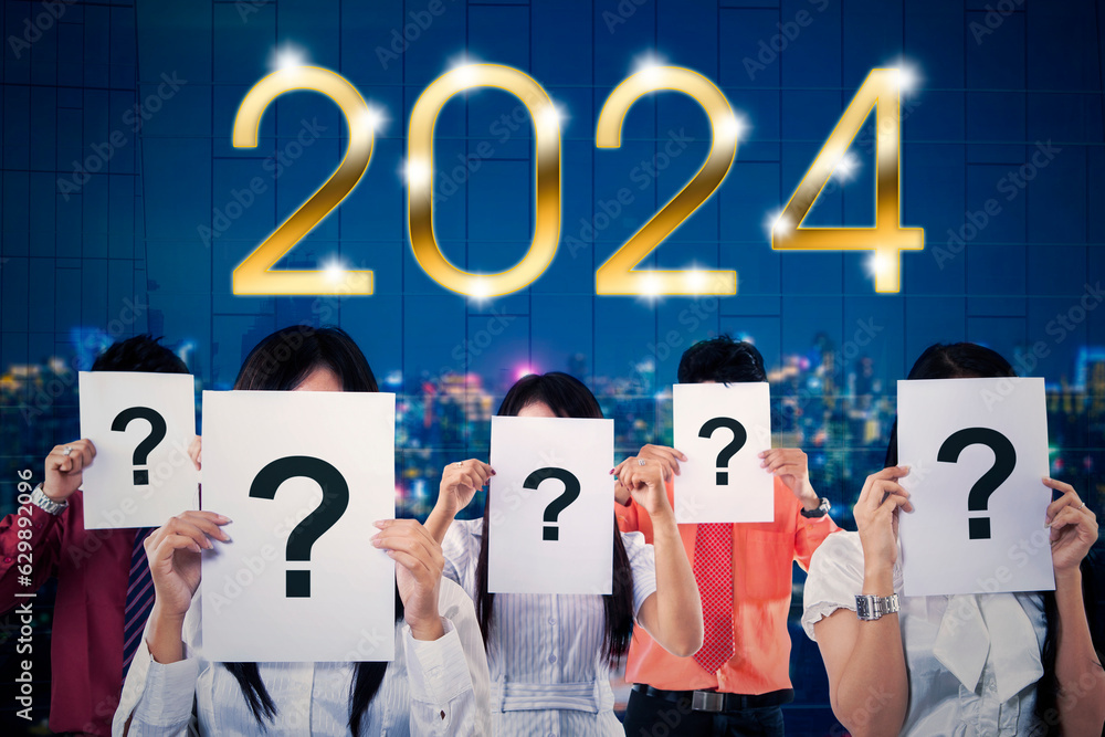 Group of business people covering their face with question mark in the ...