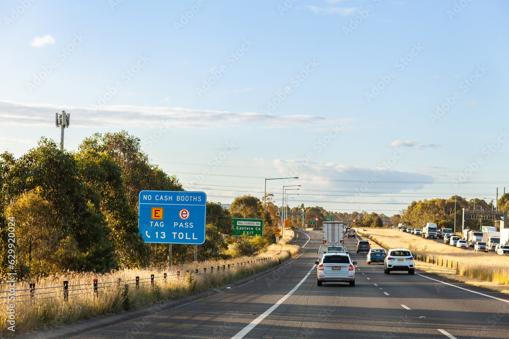E tag no cash booths sign on roadside of inner city bypass Stock Photo ...