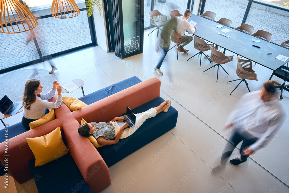 Overhead View Of Modern Open Plan Office With Staff Working Around ...