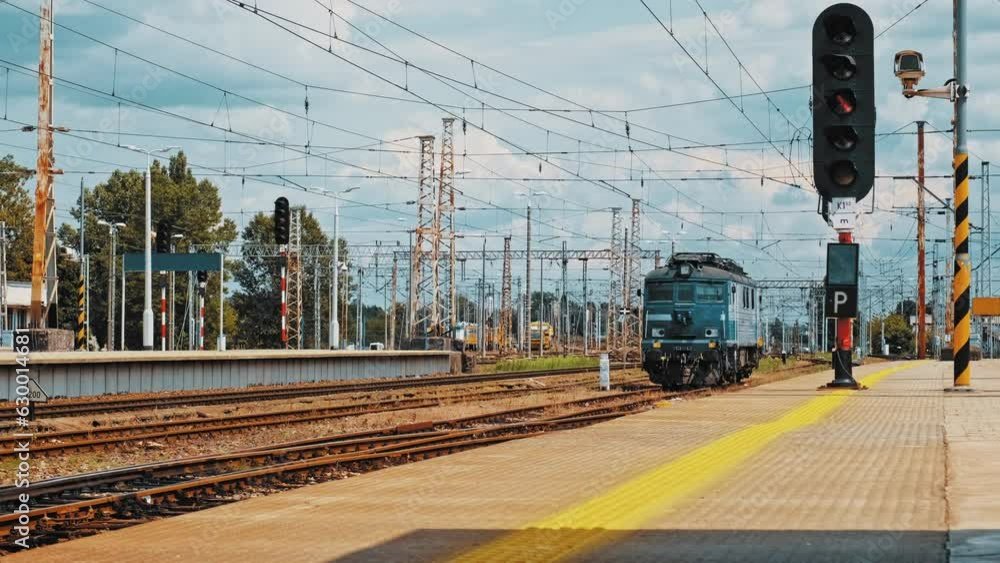 Electric Train Locomotive Parked on Railroad Track By Railway Station ...