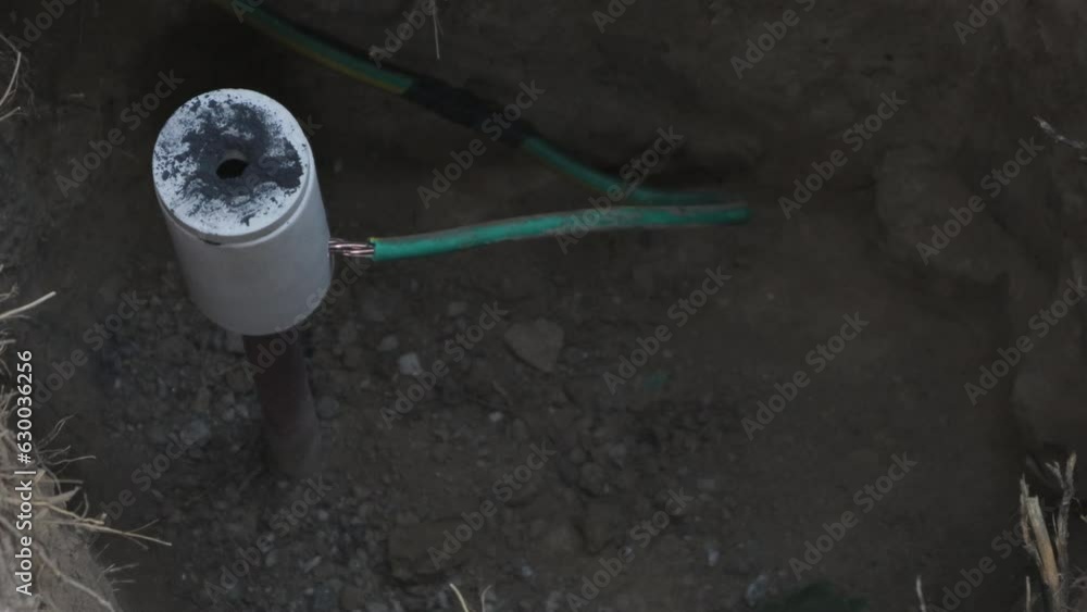 Grounding system using copper wires connected to copper rods buried in ...