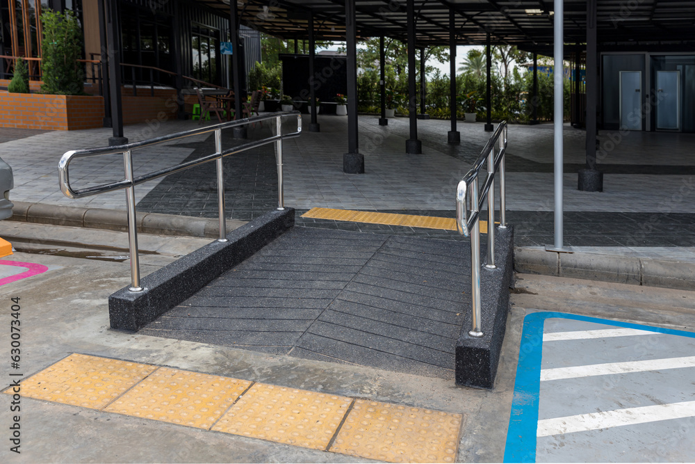 Disabled way in front of building. Handicapped traffic symbol on the ...