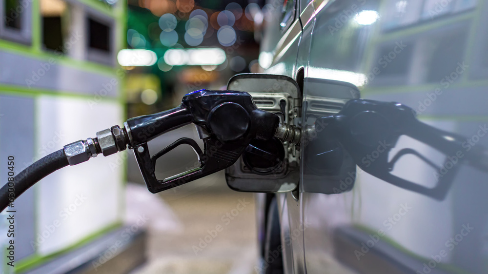 Refill and filling Oil Gas Fuel at station. Gas station - refueling. To ...