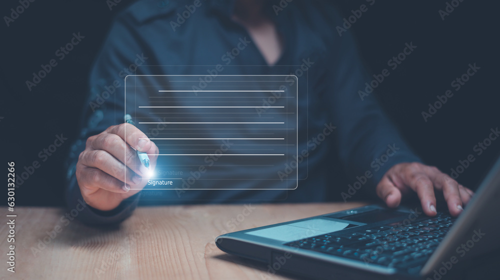 Electronic signature concept, Businessman using a pen to sign ...