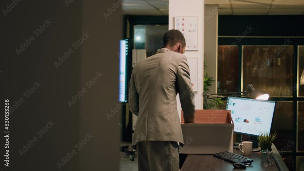 Upset employee leaving modern office after deciding to quit. Frustrated ...