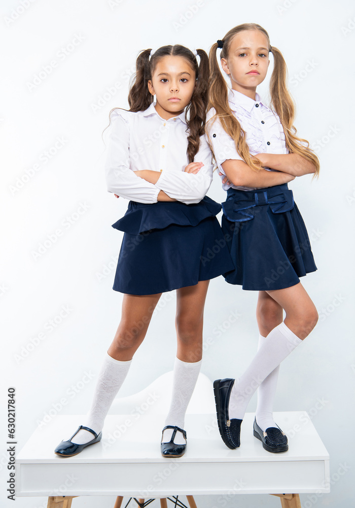 high school education. school uniform fashion. children girls on desk ...