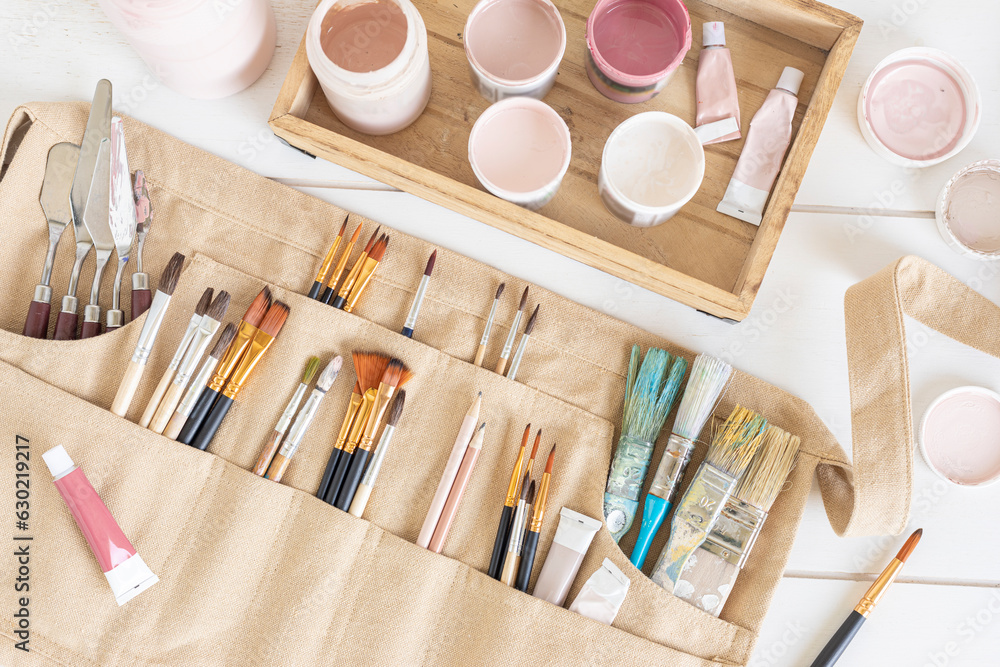 Painter's belt for artists with painting brushes, tools and colors ...
