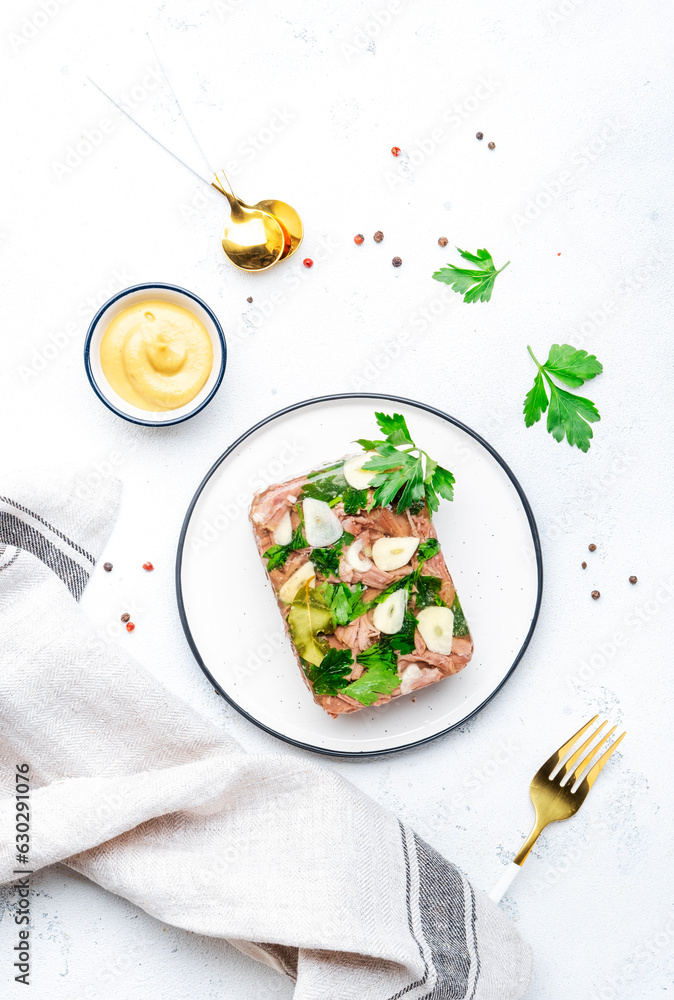 Winter Aspic meat, cold boiled beef in spiced jelly broth on plate with ...