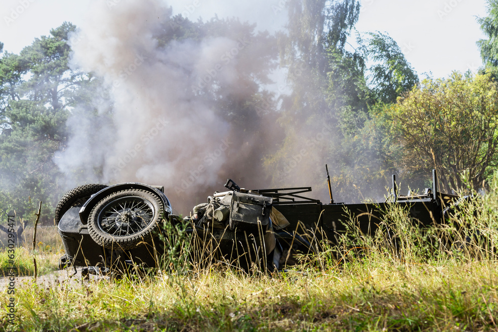 Historical reconstruction. An overturned and dirty German motorcycle ...